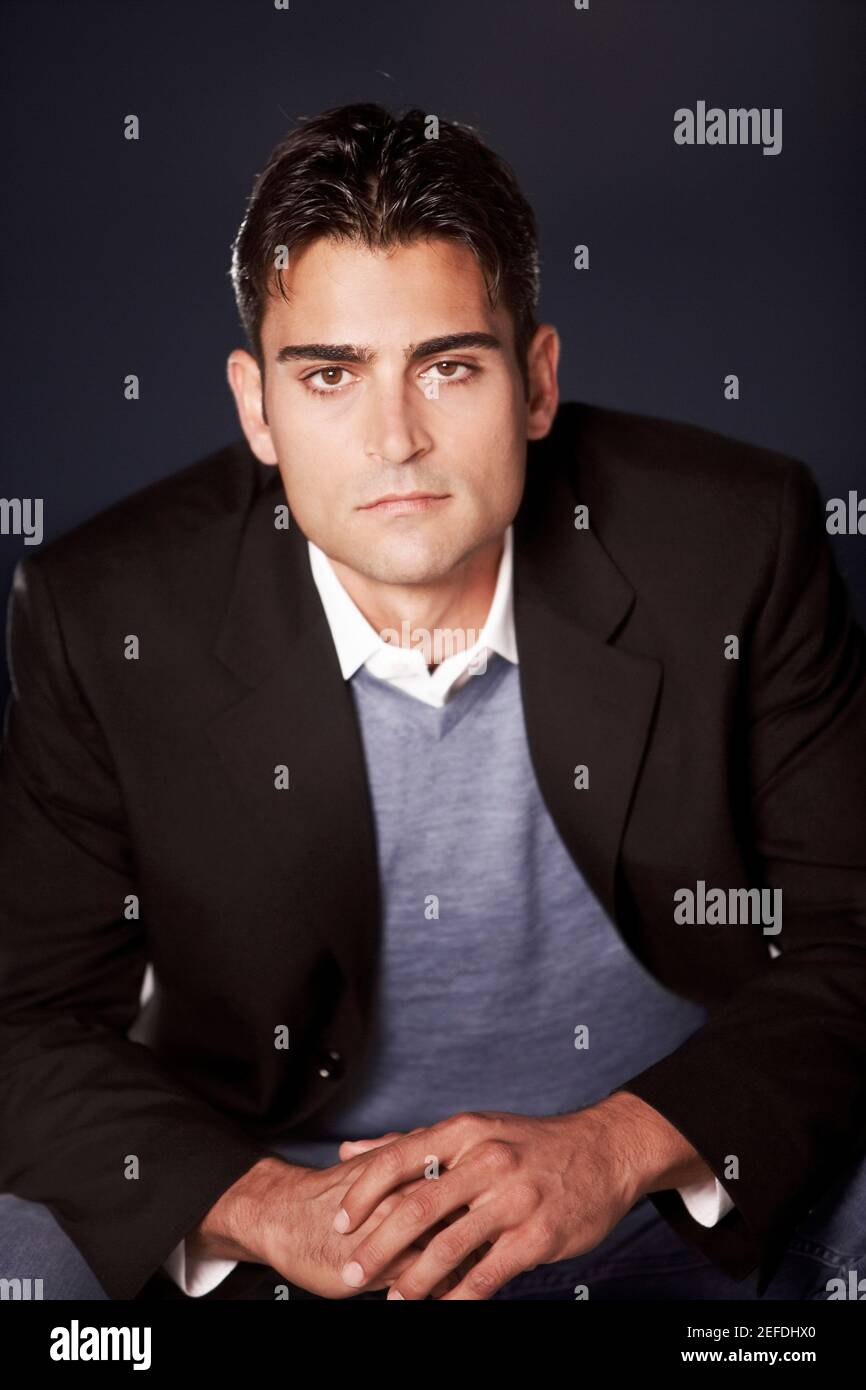 Portrait of a mid adult man looking serious Stock Photo - Alamy