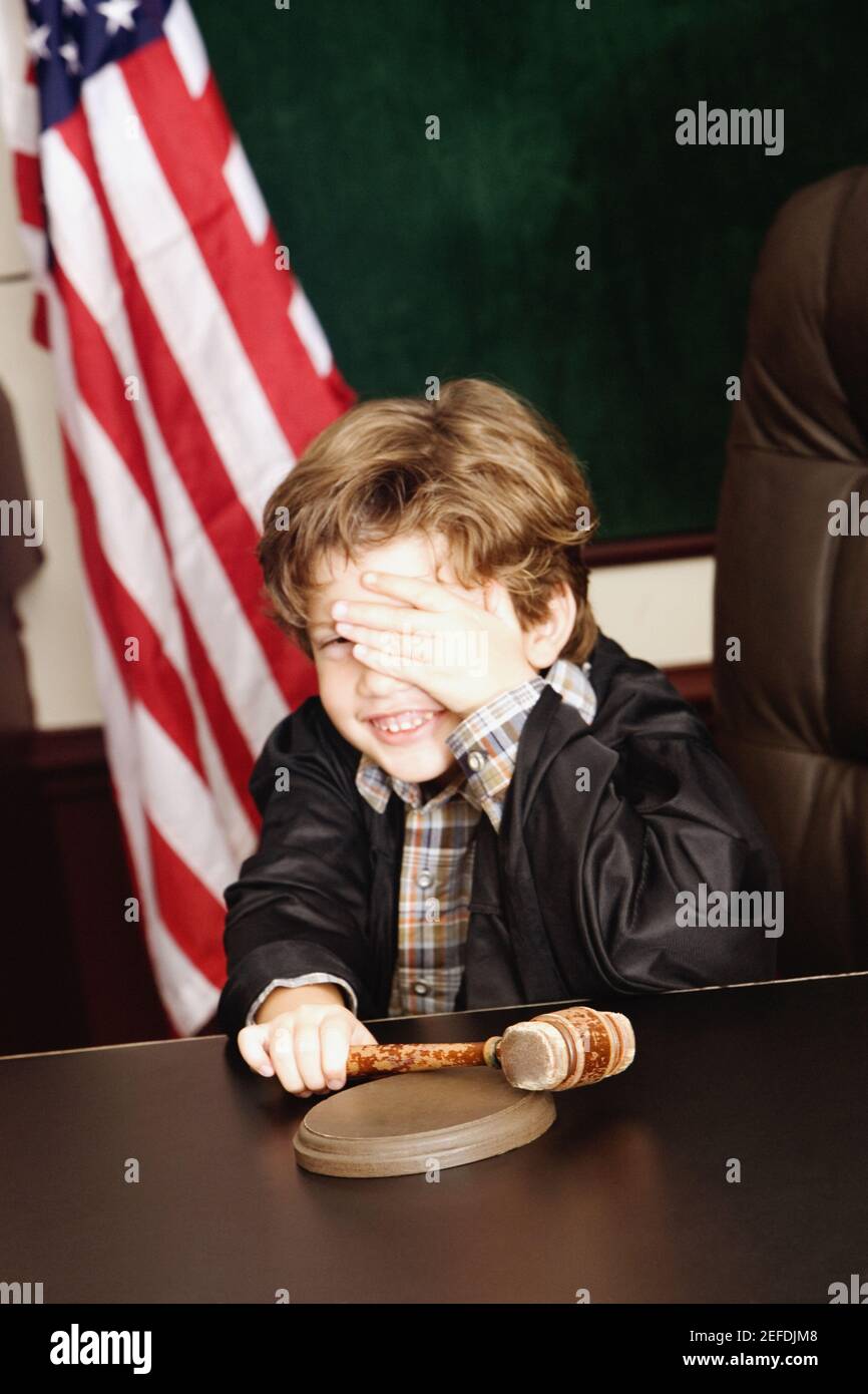 Boy imitating a judge Stock Photo - Alamy