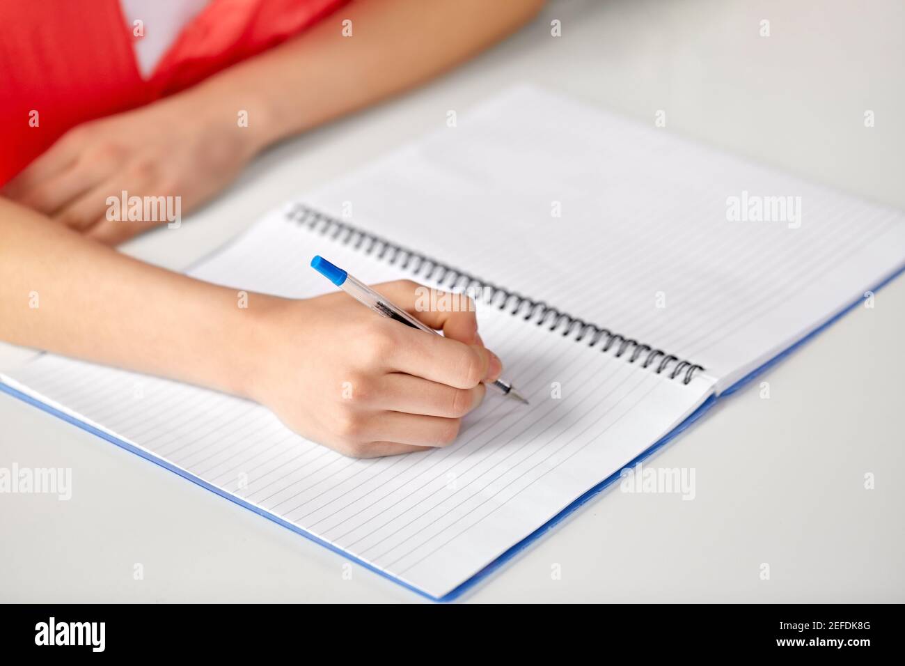 Hands writing exam paper hi-res stock photography and images - Alamy