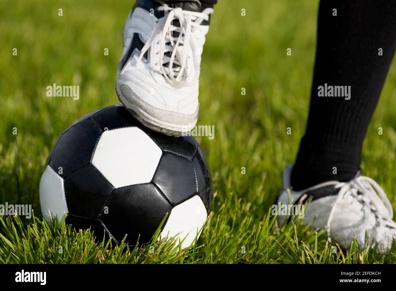 Foot resting on ball hi-res stock photography and images - Alamy