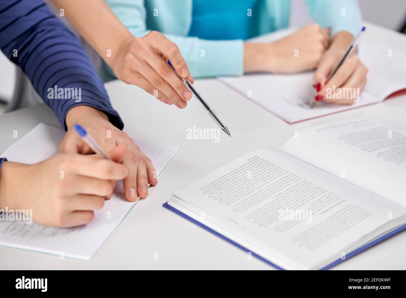 hands of students with books and notebooks Stock Photo - Alamy