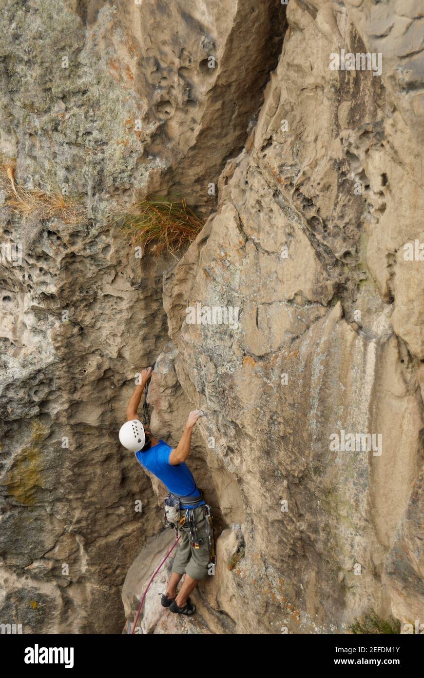 Male climber scaling rock face hi-res stock photography and images - Alamy