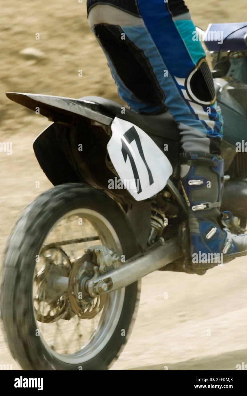 Low section view of a motocross rider riding a motorcycle Stock Photo ...