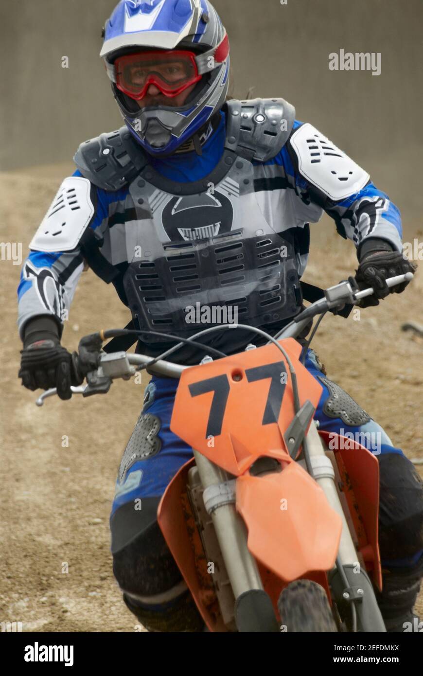 Motocross rider riding a motorcycle Stock Photo - Alamy