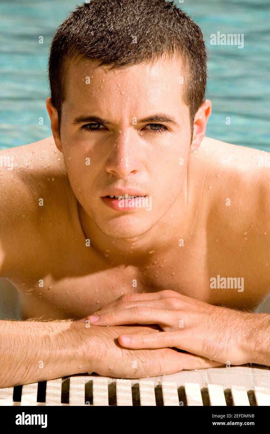 Portrait of a young man in a swimming pool Stock Photo - Alamy