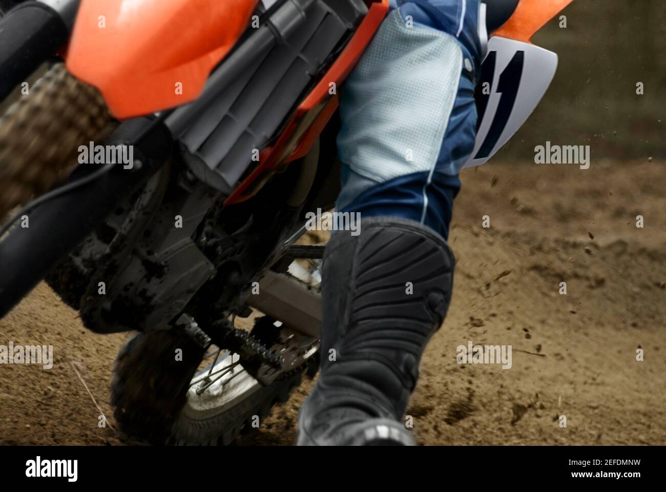 Low section view of a motocross rider riding a motorcycle Stock Photo ...