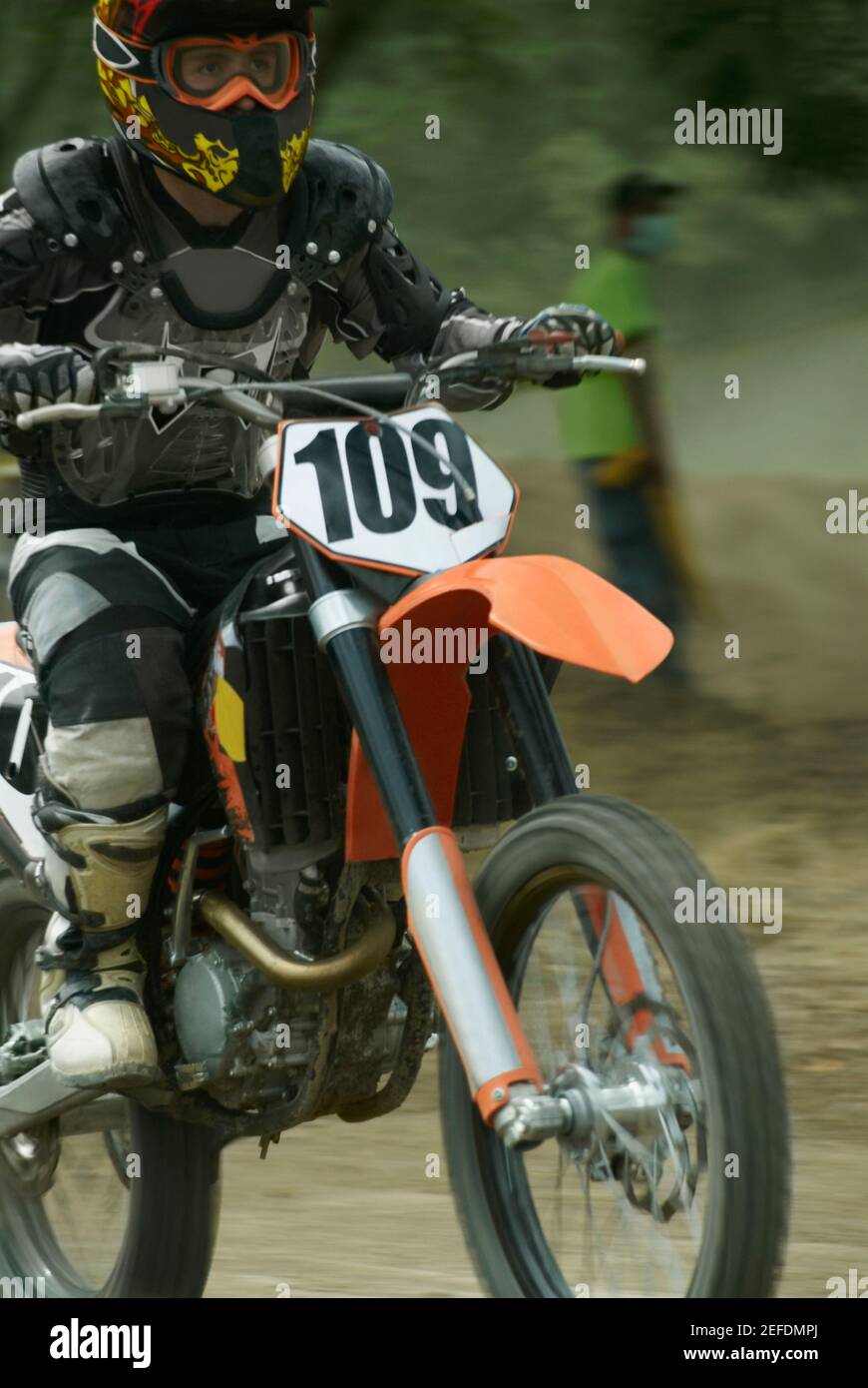 Motocross rider riding a motorcycle Stock Photo - Alamy