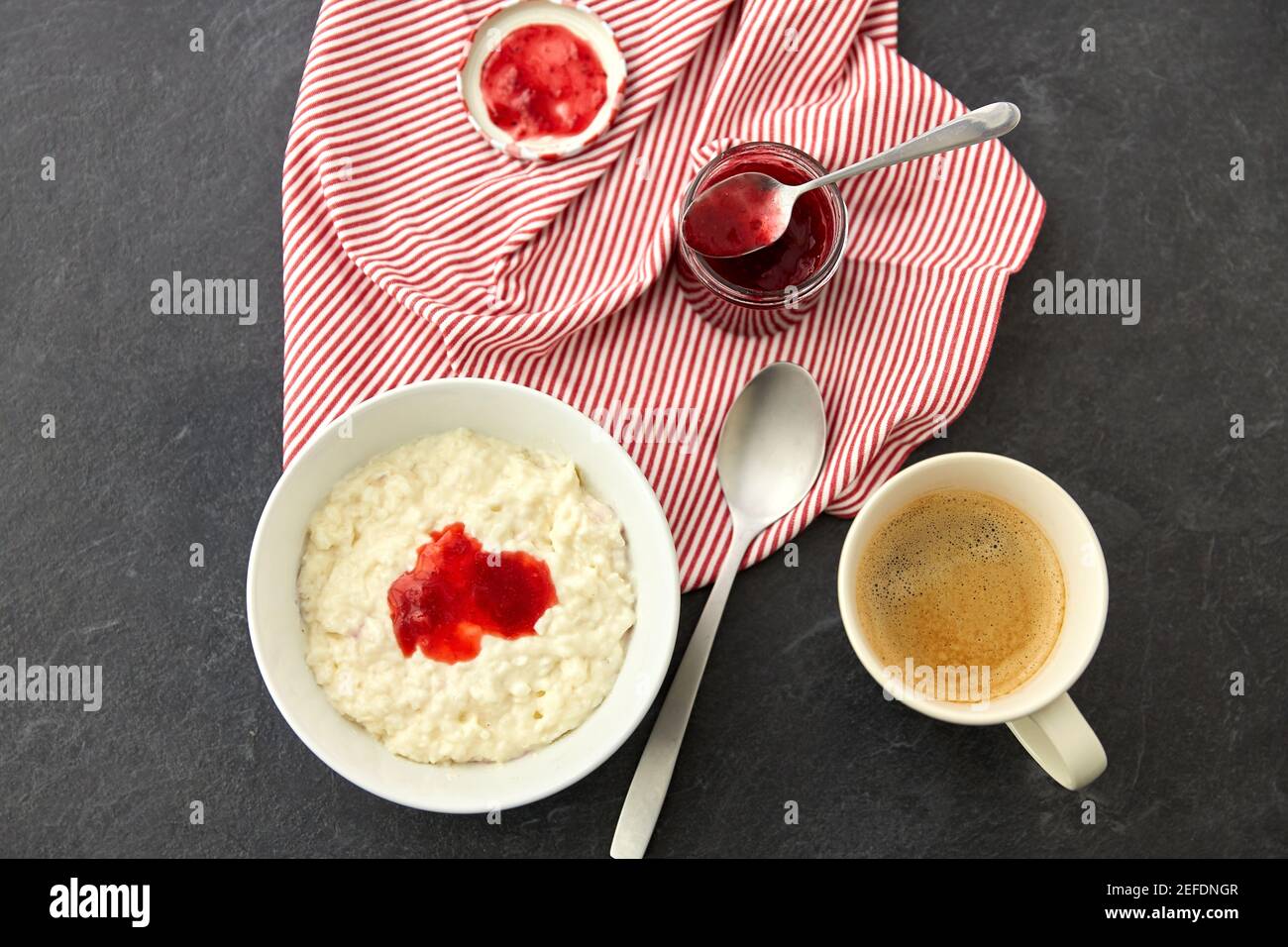 porridge breakfast with jam, spoon and coffee Stock Photo - Alamy