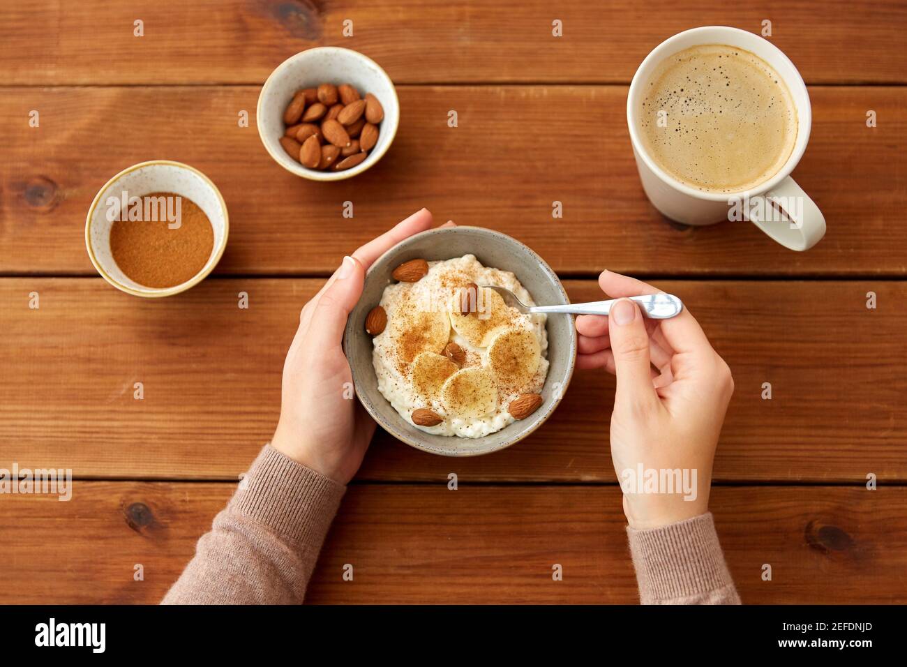 Hands oatmeal breakfast cup hi-res stock photography and images - Alamy