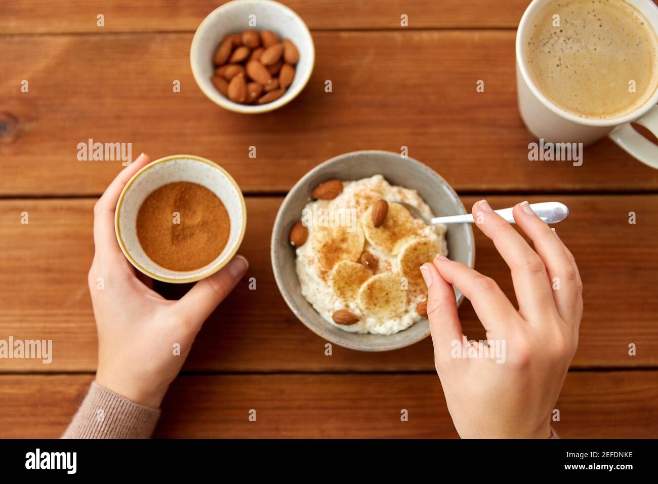 Hands oatmeal breakfast cup hi-res stock photography and images - Alamy