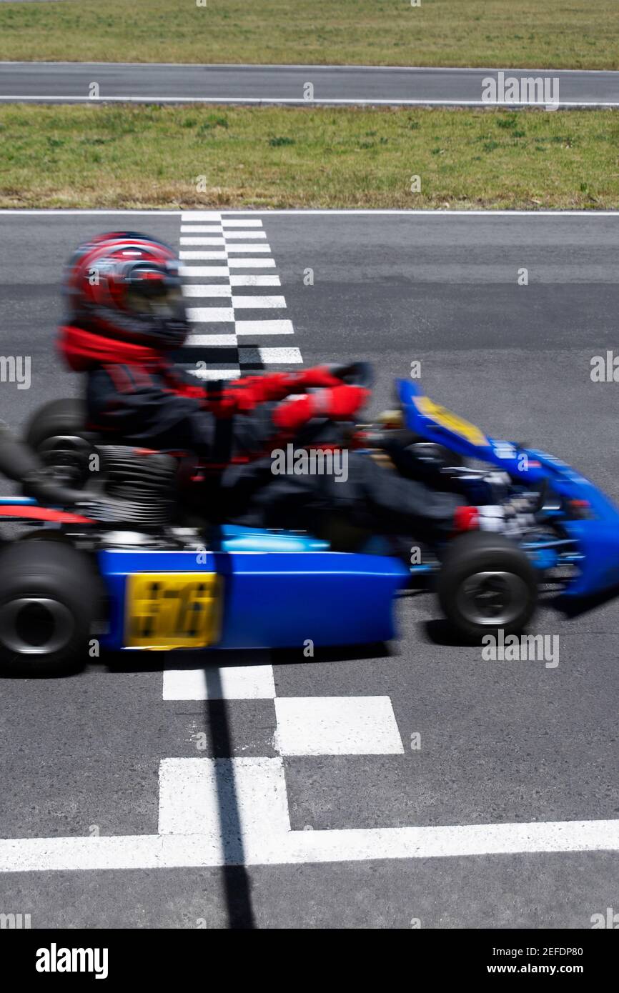 Go-cart racer crossing the finish line Stock Photo - Alamy
