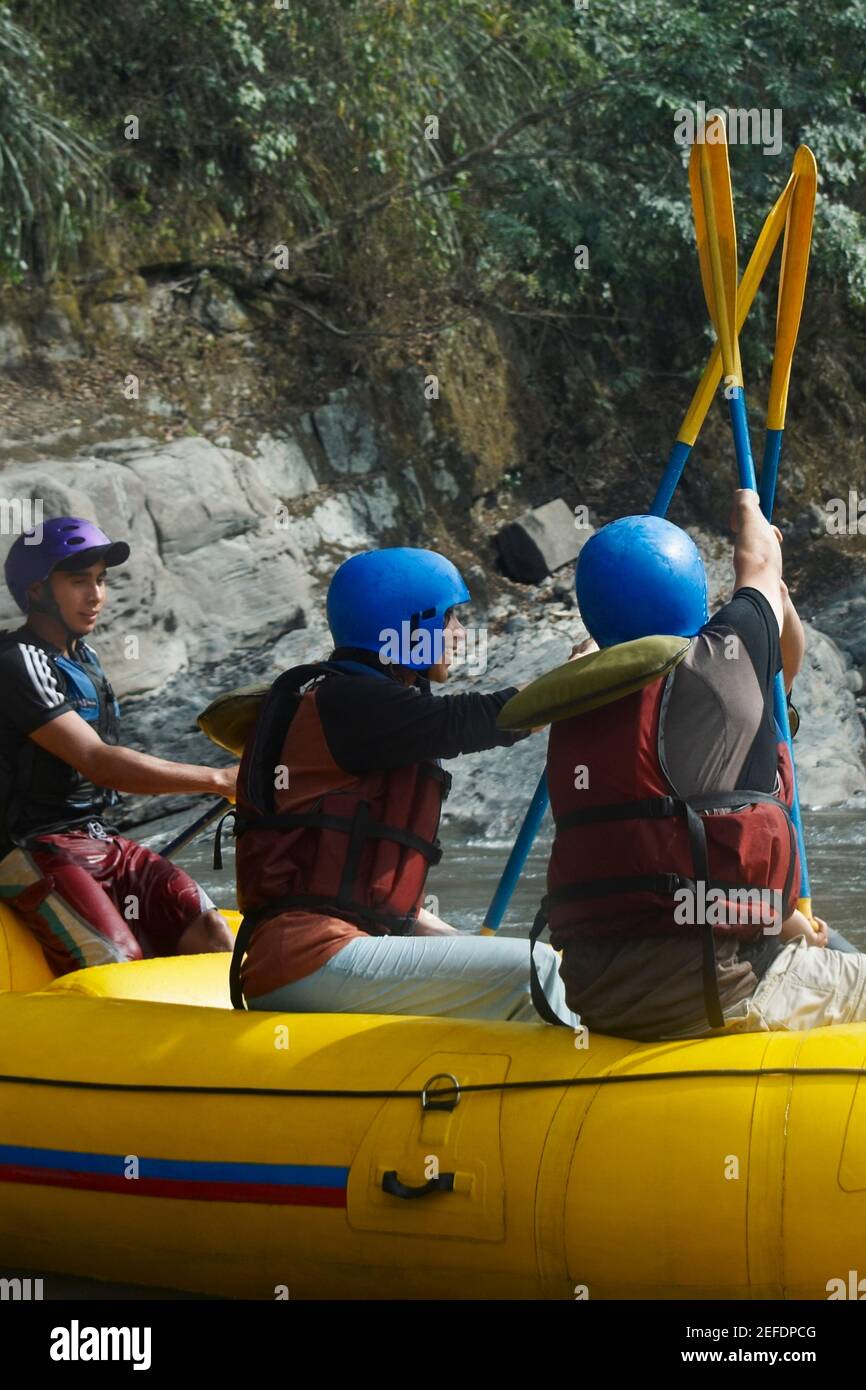 Three people on an inflatable raft Stock Photo - Alamy