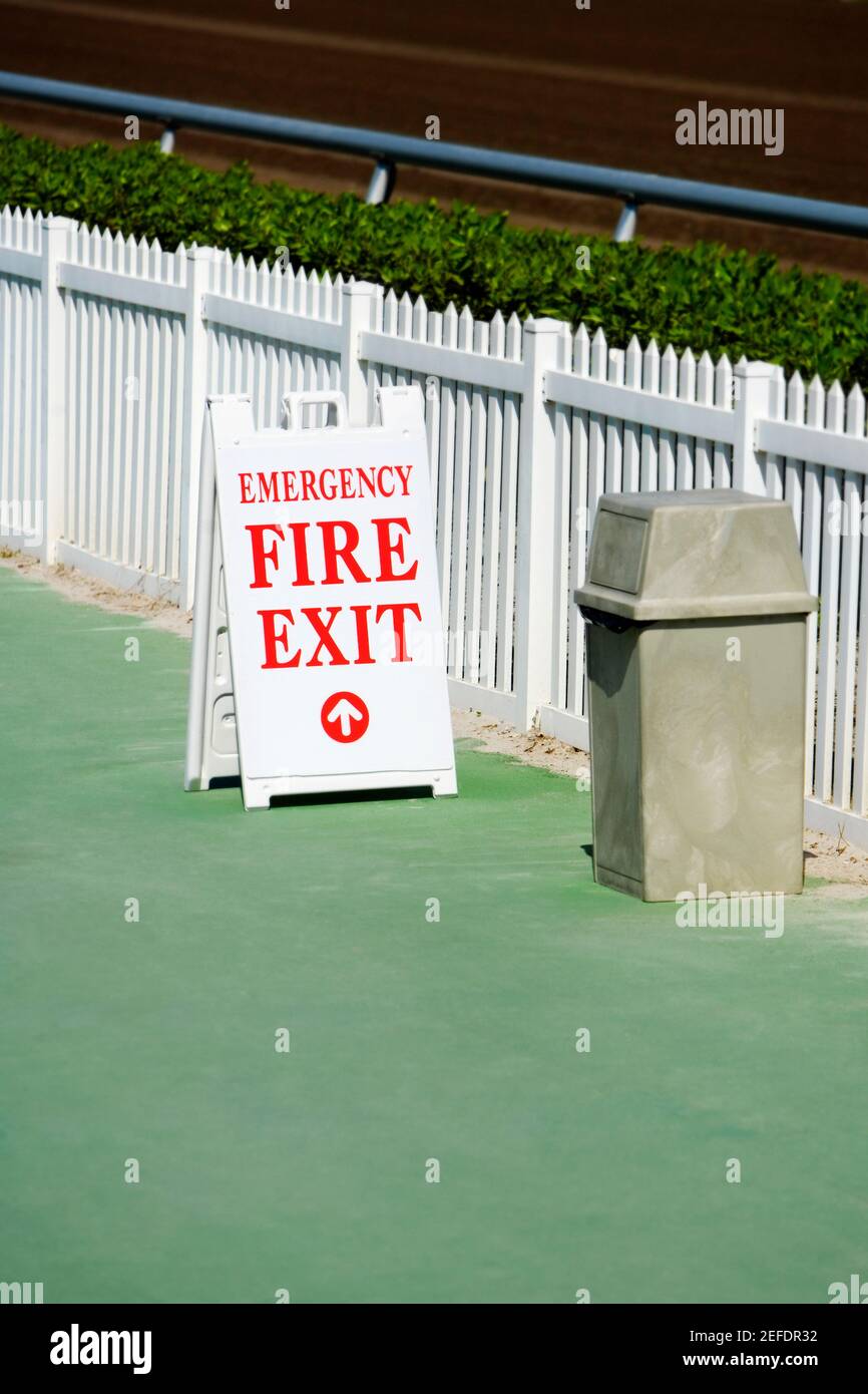 Fire exit signboard on the road Stock Photo - Alamy