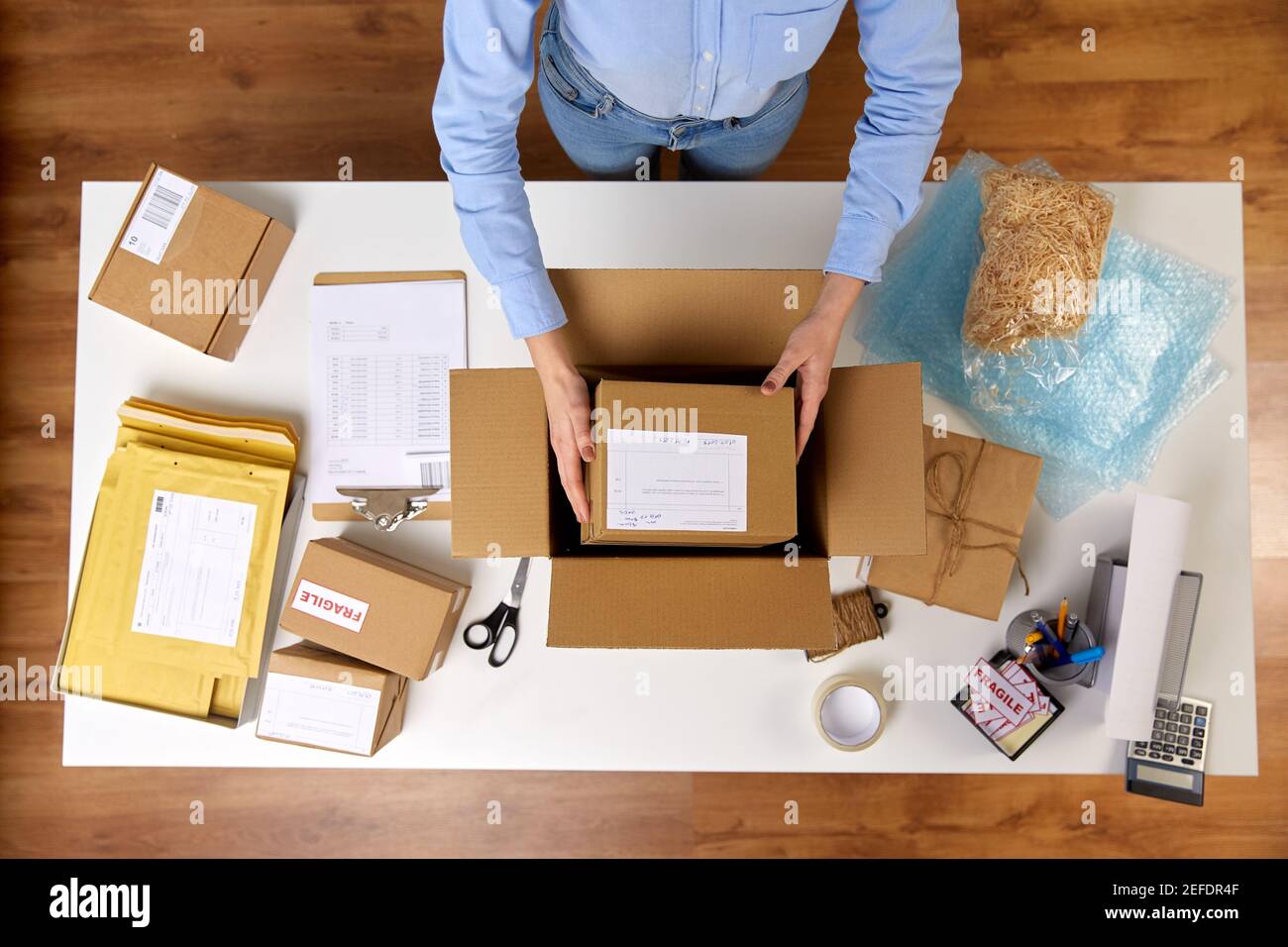 Woman packing boxes shipment hi-res stock photography and images - Alamy