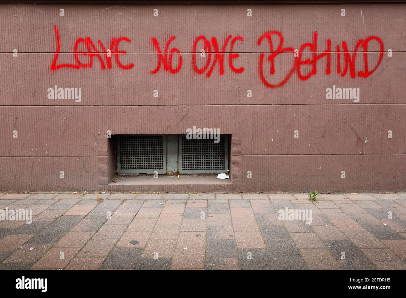 Leave No One Behind, Graffiti, Writing On A House Wall Stock Photo - Alamy