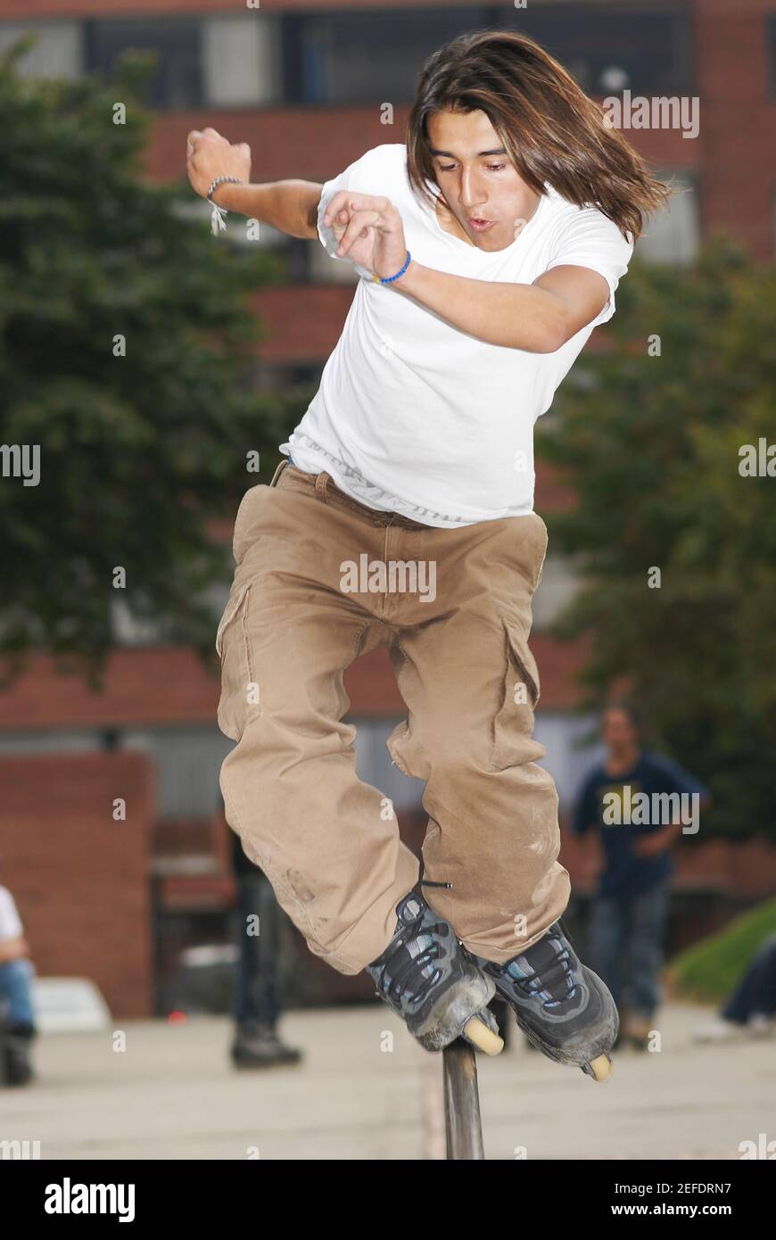 Young man skating on a pipe Stock Photo - Alamy