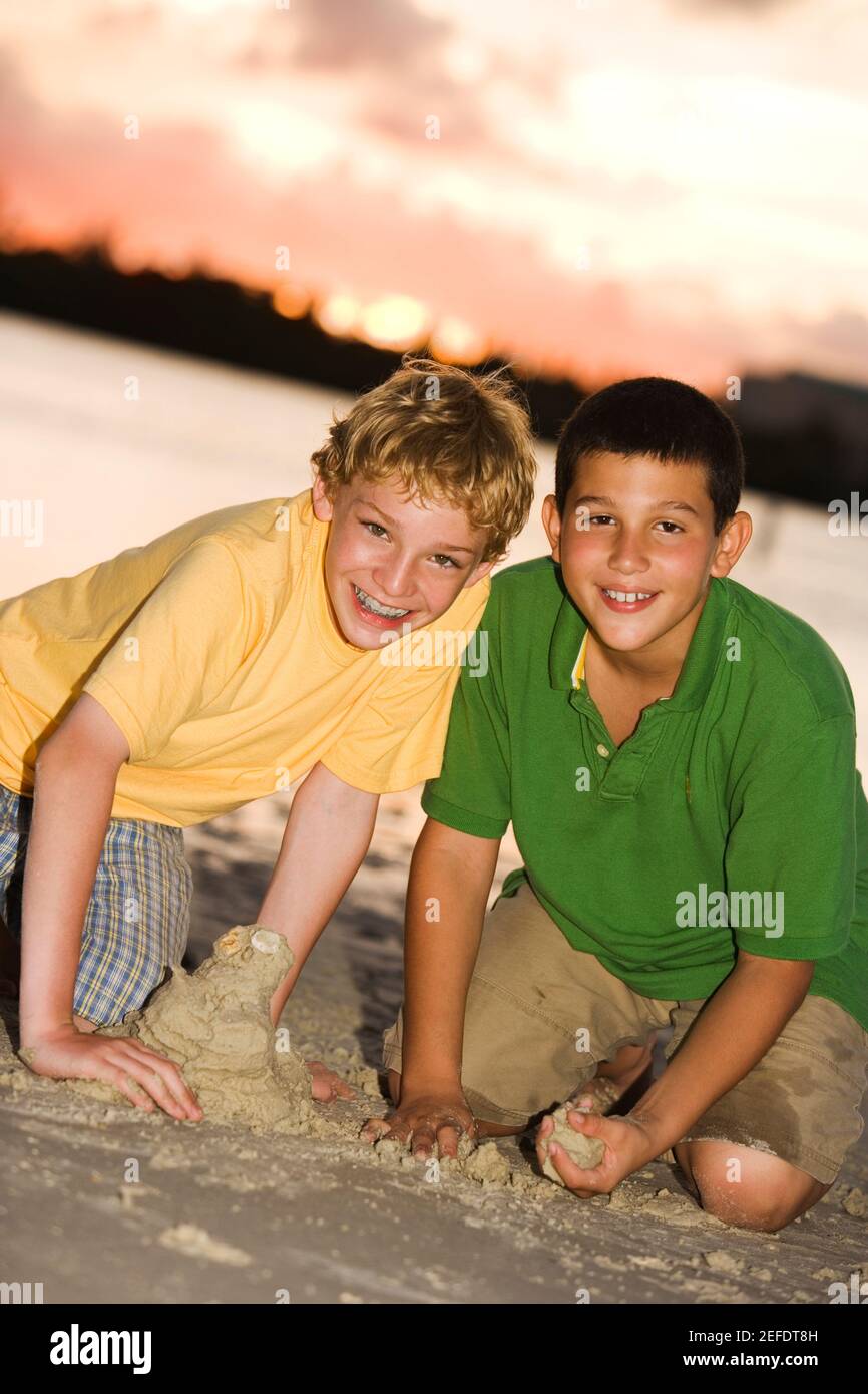Portrait of two brothers smiling Stock Photo - Alamy