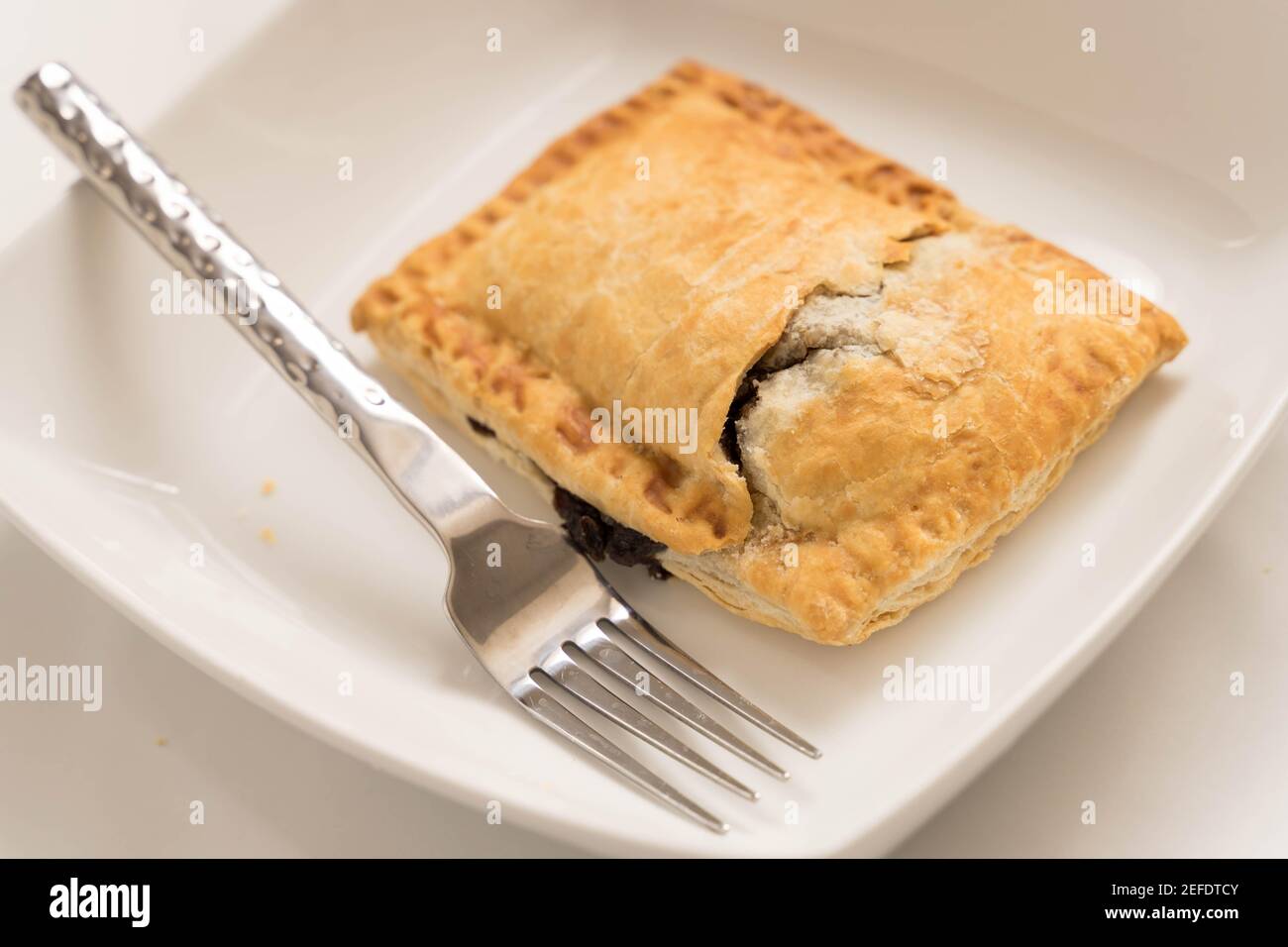Beef pie slice on white ceramic plate Stock Photo - Alamy