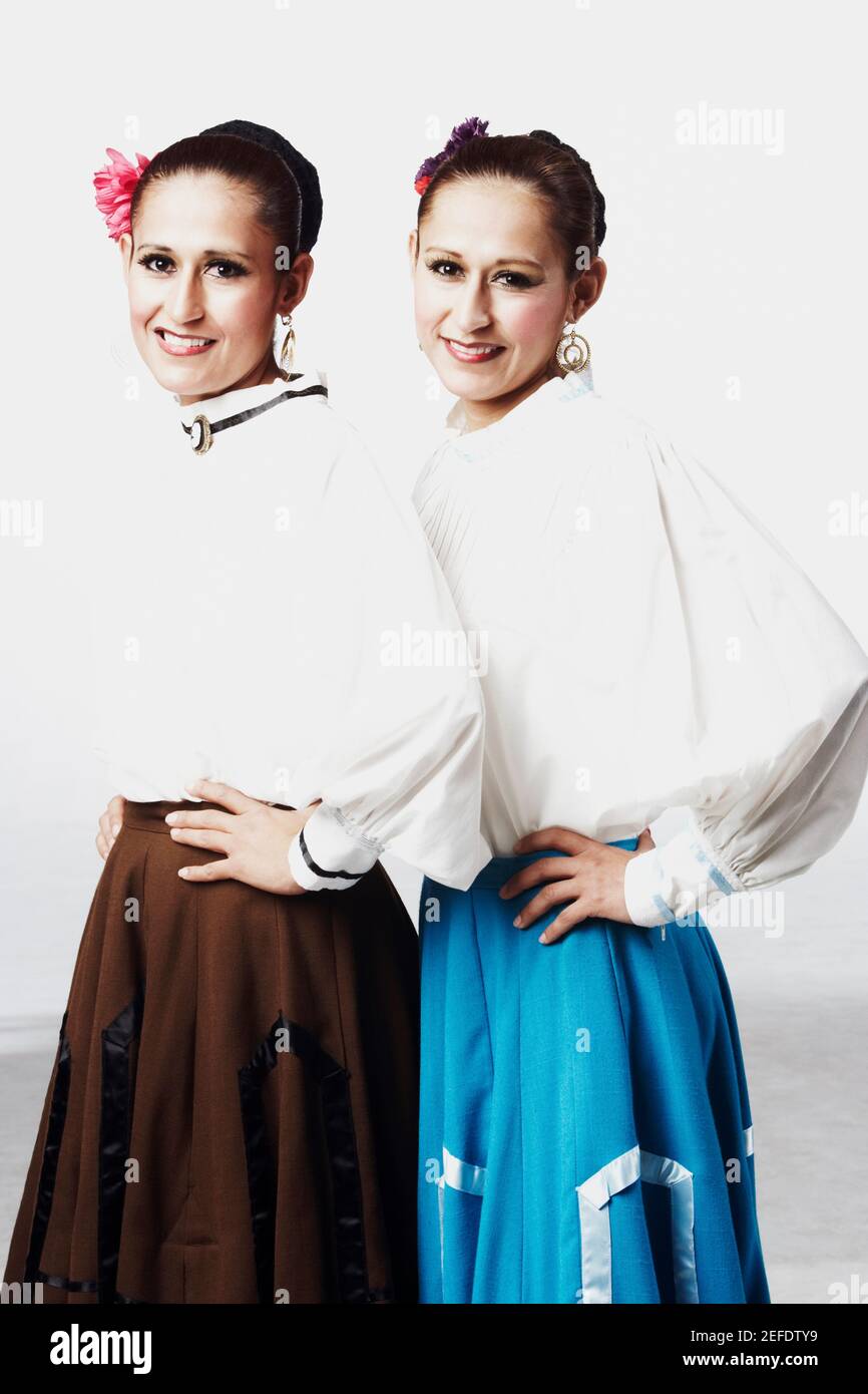 Portrait of two young women posing together Stock Photo - Alamy