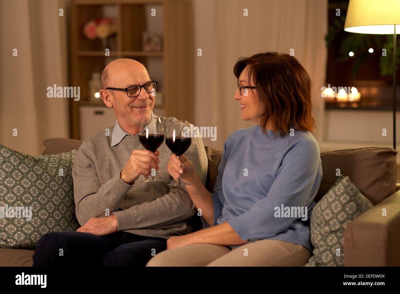 happy senior couple with glasses of red wine Stock Photo - Alamy