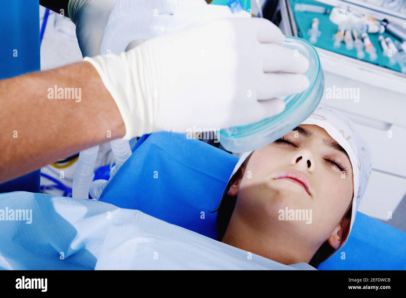 Doctor Putting Oxygen Mask On High Resolution Stock Photography and ...