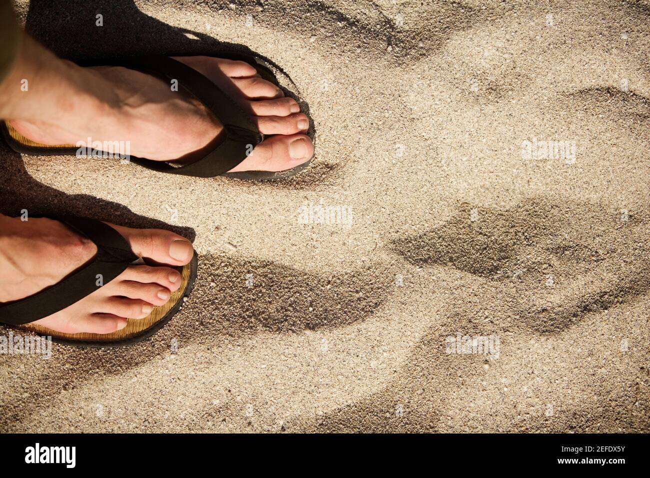Close-up of human feet wearing sandals Stock Photo - Alamy
