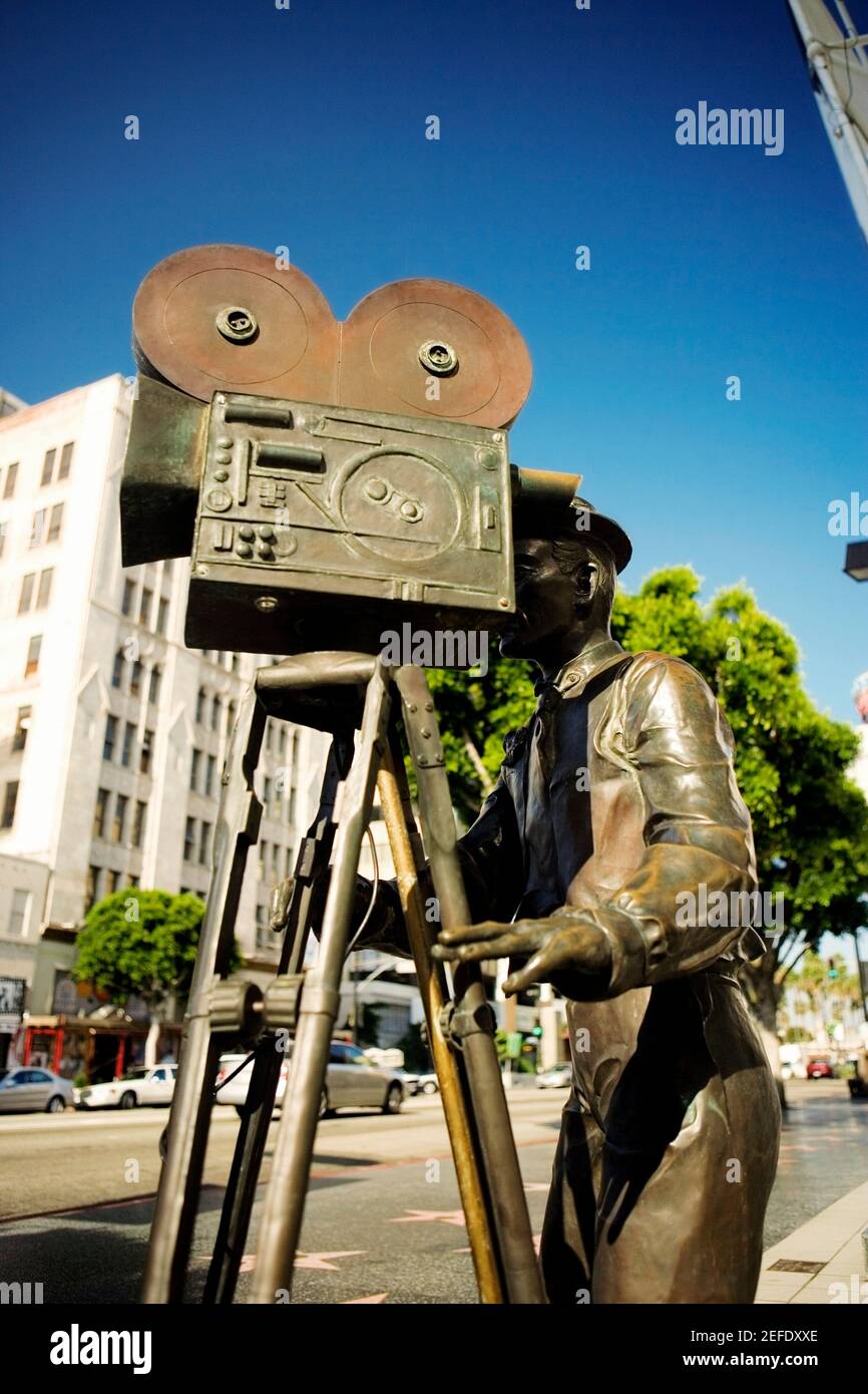 Side profile of the statue of a filmmaker, Los Angeles, California, USA ...