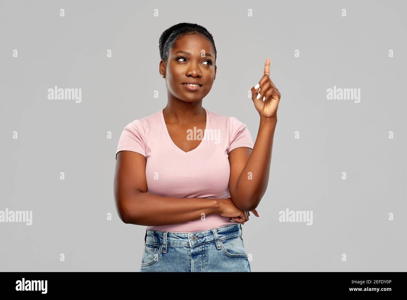 happy african american woman pointing finger up Stock Photo - Alamy