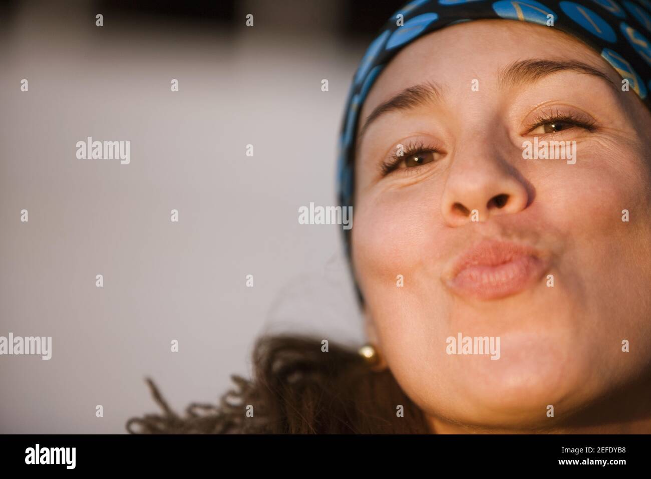 Portrait of a mid adult woman puckering her lips Stock Photo - Alamy