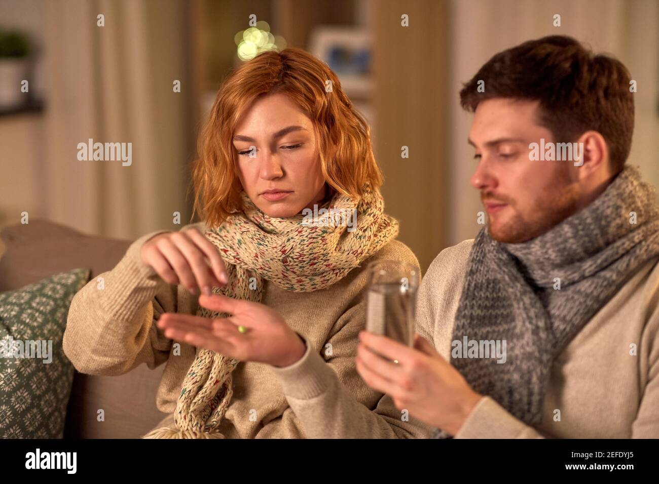 sick couple taking medicine at home Stock Photo - Alamy