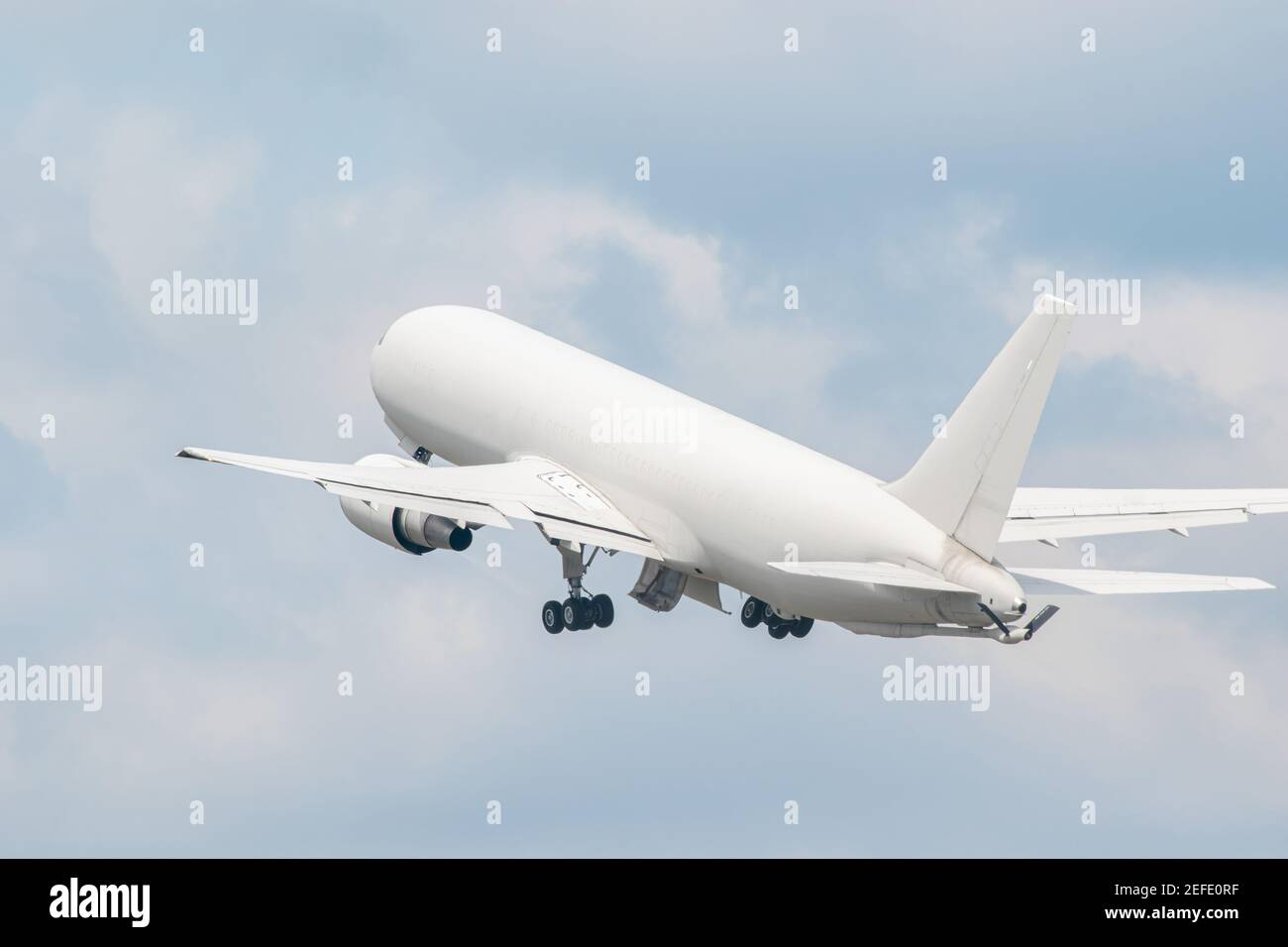 an airplane getting to take off with blue sky background Stock Photo ...