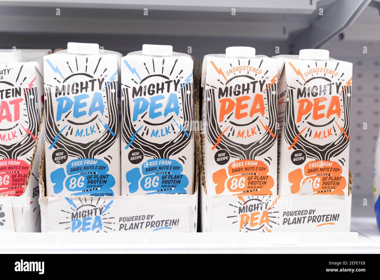 a row of Mighty pea milk cartons with plant protein on shelf Stock ...
