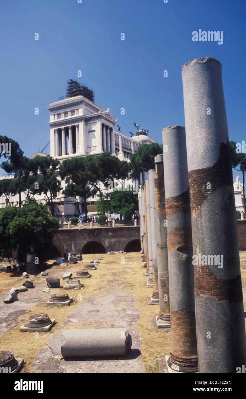 Broken columns in front of a building, Italy Stock Photo - Alamy