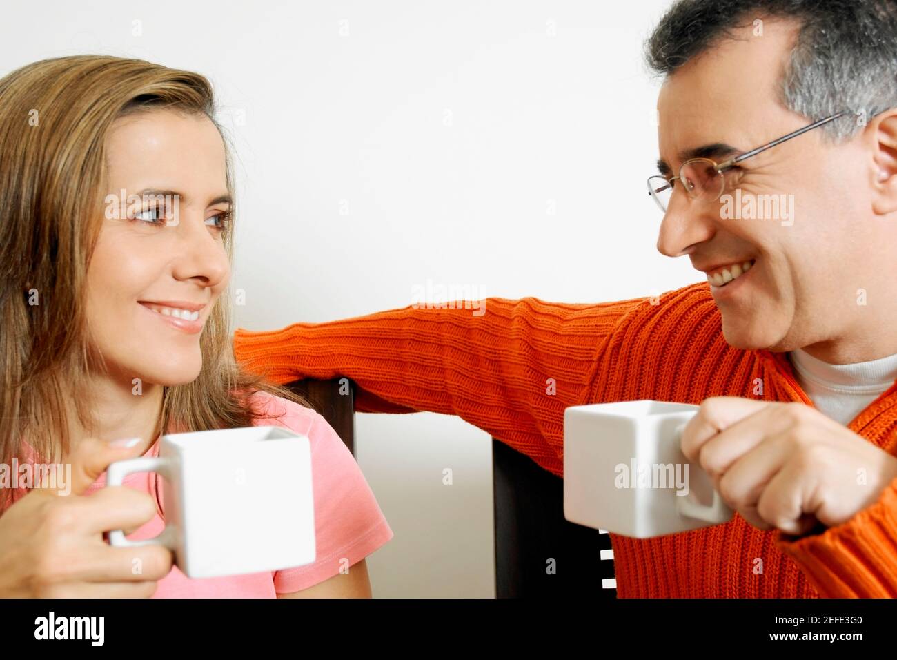 Woman holding two cups brown hi-res stock photography and images - Alamy