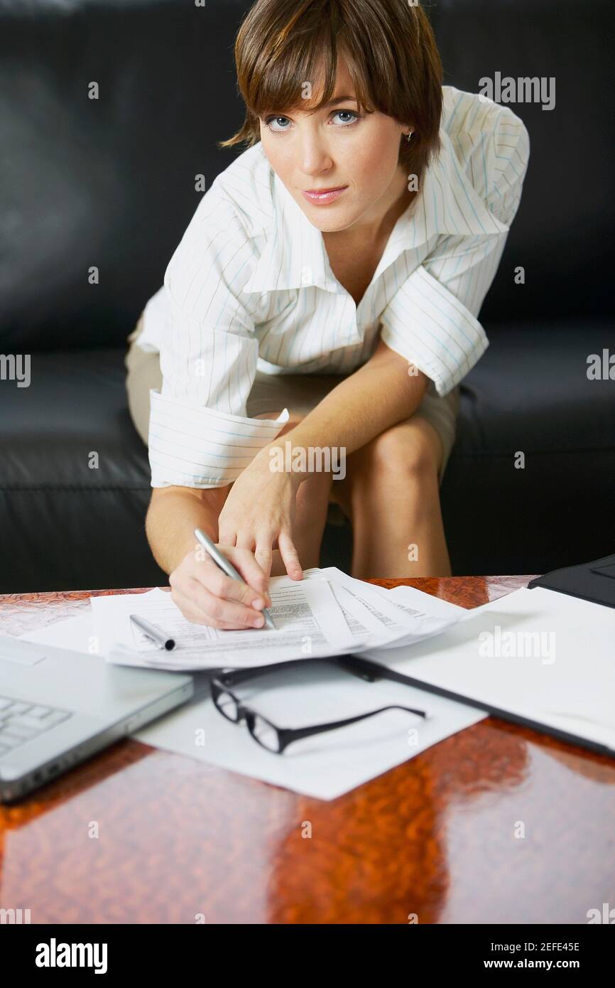 Woman bending over table hi-res stock photography and images - Alamy