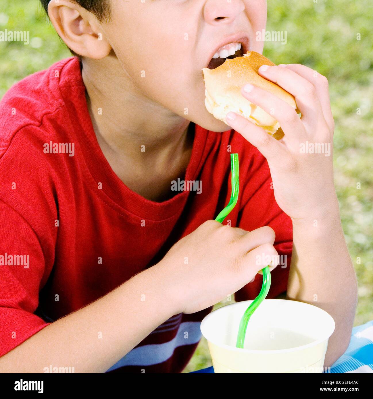 Kid eating burger school hi-res stock photography and images - Alamy