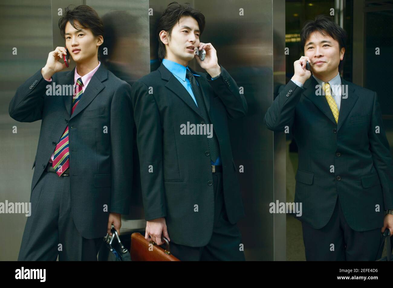 Black, asian businessmen hi-res stock photography and images - Alamy