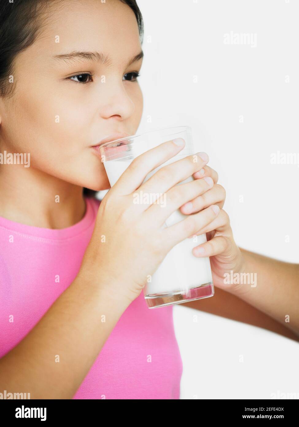 Close up of a teenage girl drinking milk from a glass Stock Photo - Alamy