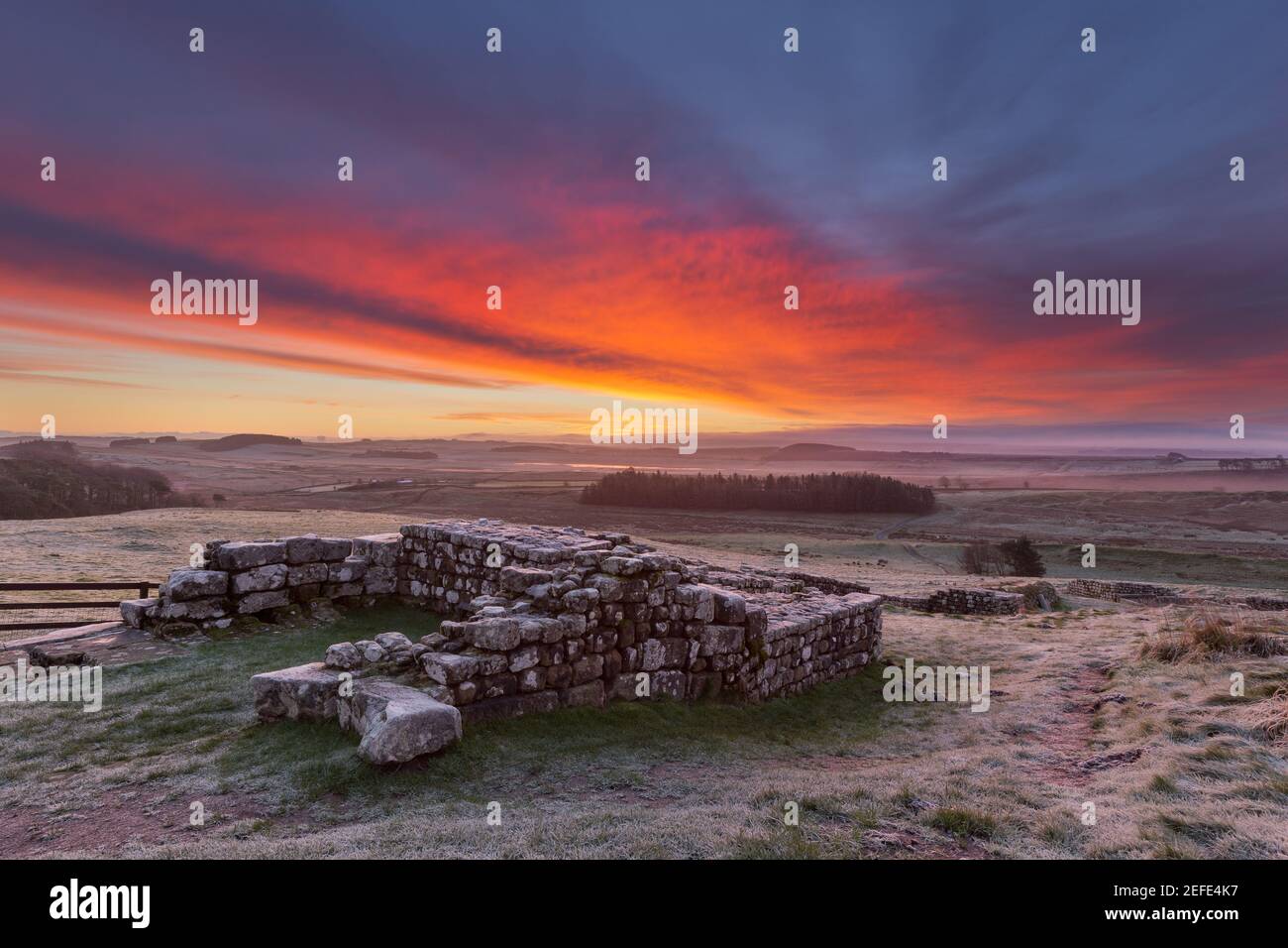 A glorious sunrise at Housesteads Roman Fort with the remains of the ...