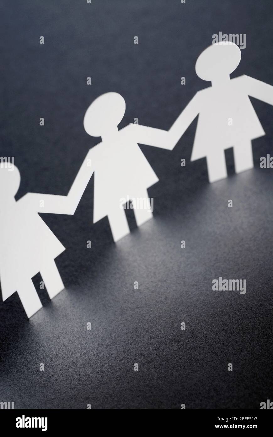 Close up of paper chain dolls Stock Photo - Alamy