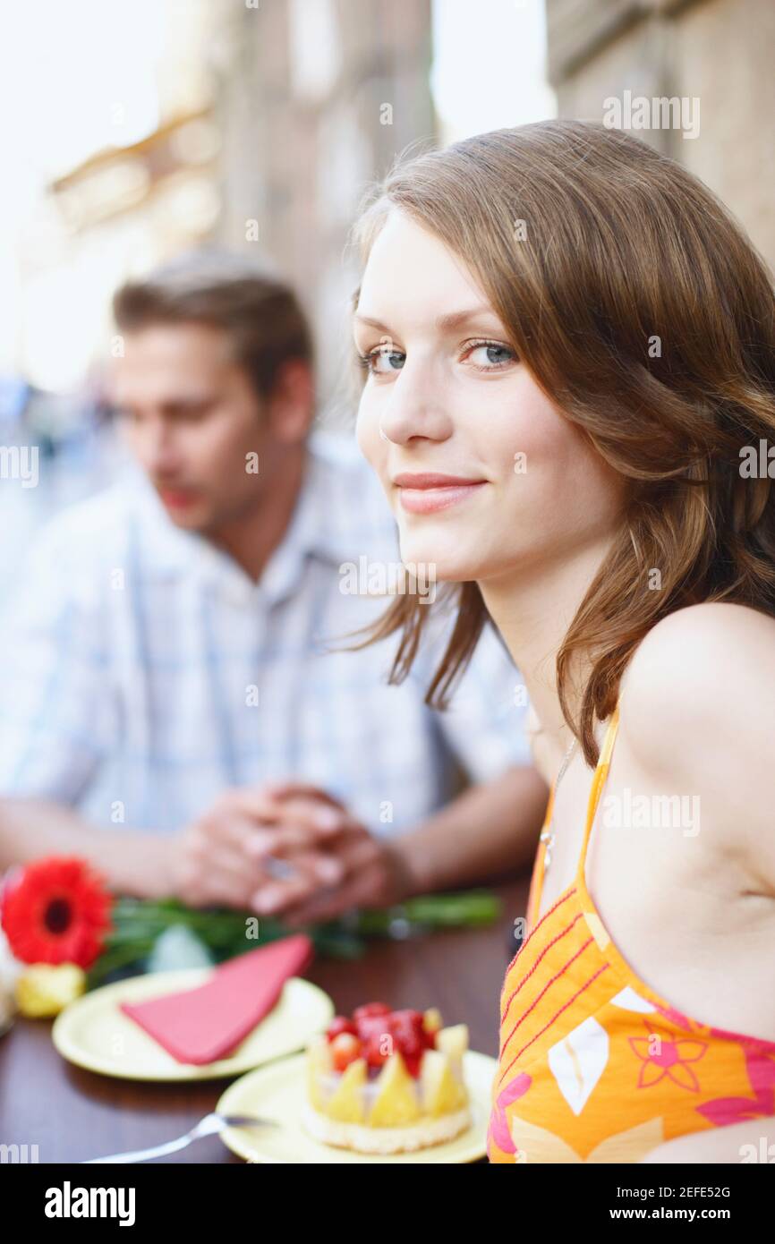 Portrait of a teenage girl seated at a table in a restaurant Stock ...
