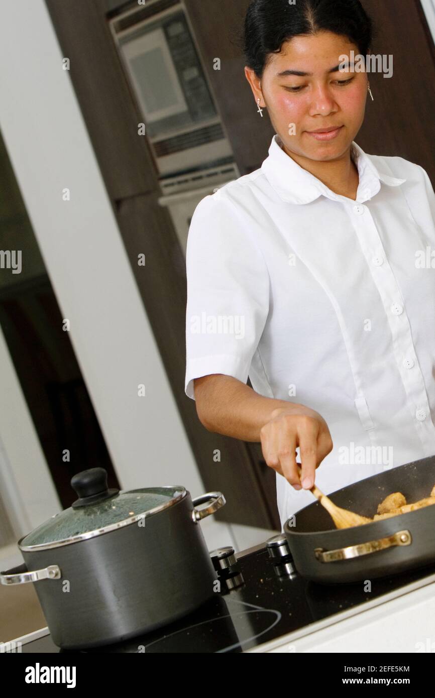 Maid preparing food in the kitchen Stock Photo - Alamy