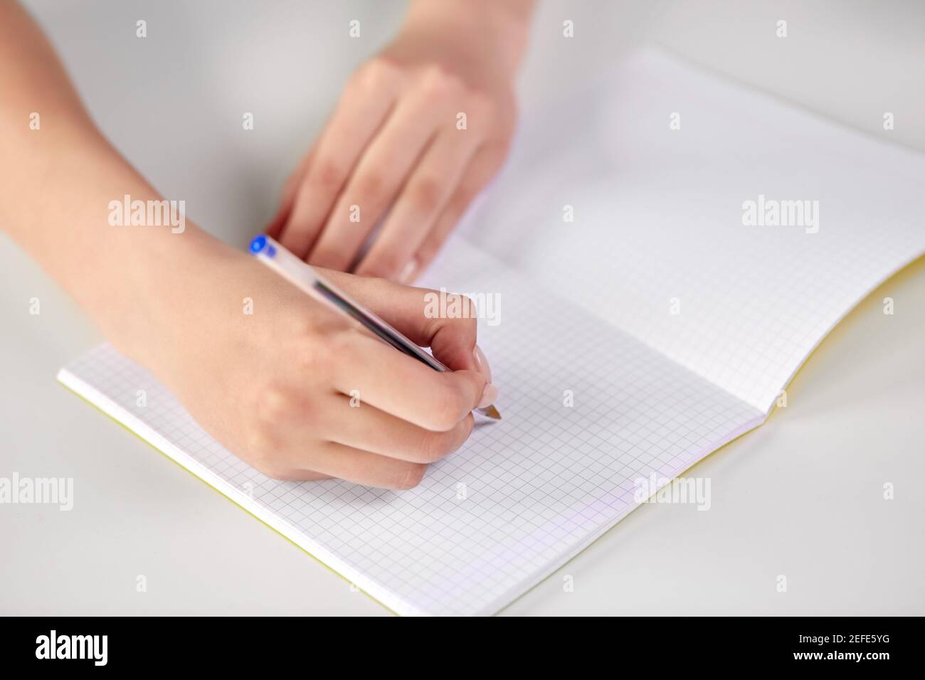 hands of student girl with pen writing to notebook Stock Photo - Alamy