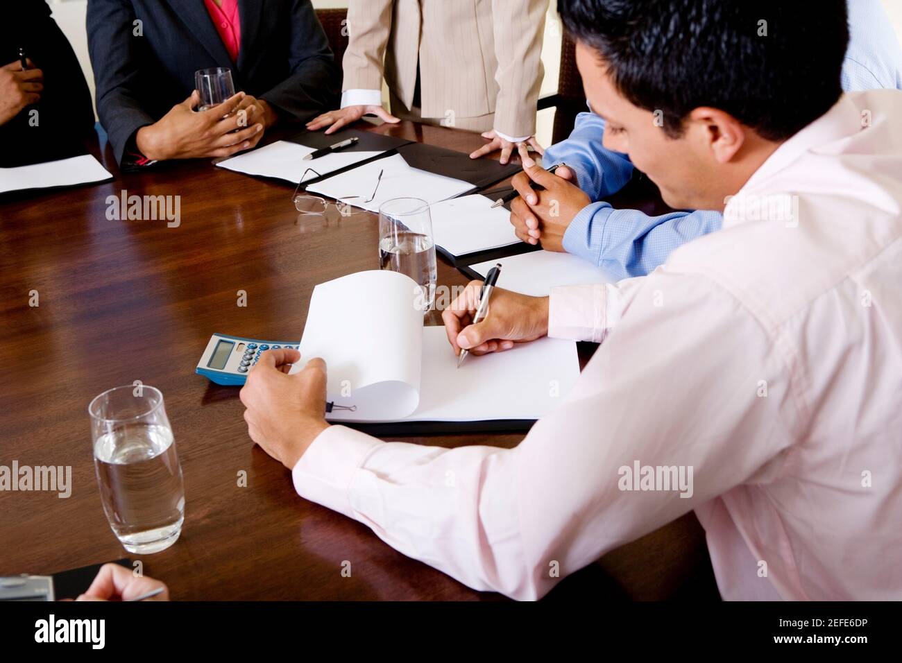 Five business executives working in an office Stock Photo - Alamy