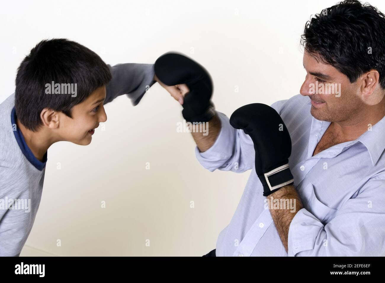 Close-up of a father and his son boxing Stock Photo - Alamy