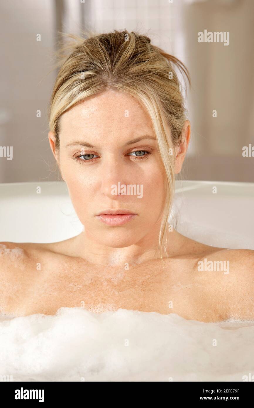 Close-up of a young woman in a bathtub Stock Photo - Alamy