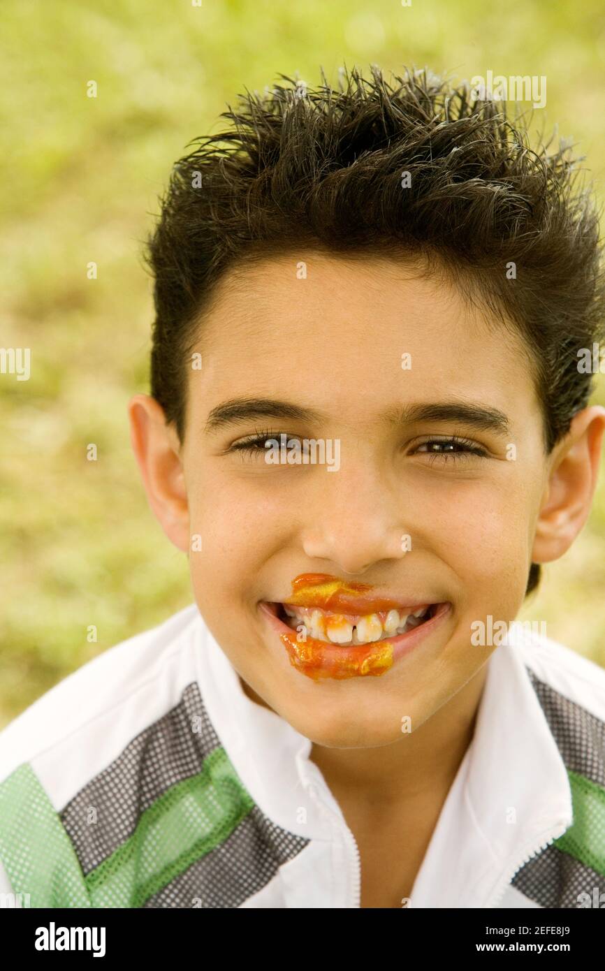 Portrait of a boy smiling with a messy face Stock Photo - Alamy