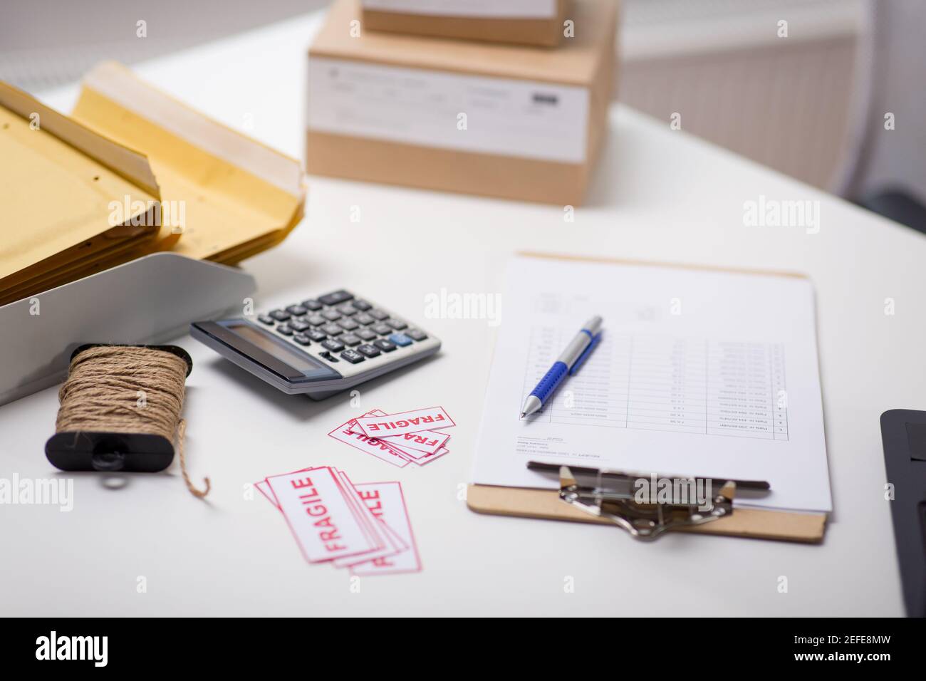 calculator, clipboard and envelopes at post office Stock Photo - Alamy
