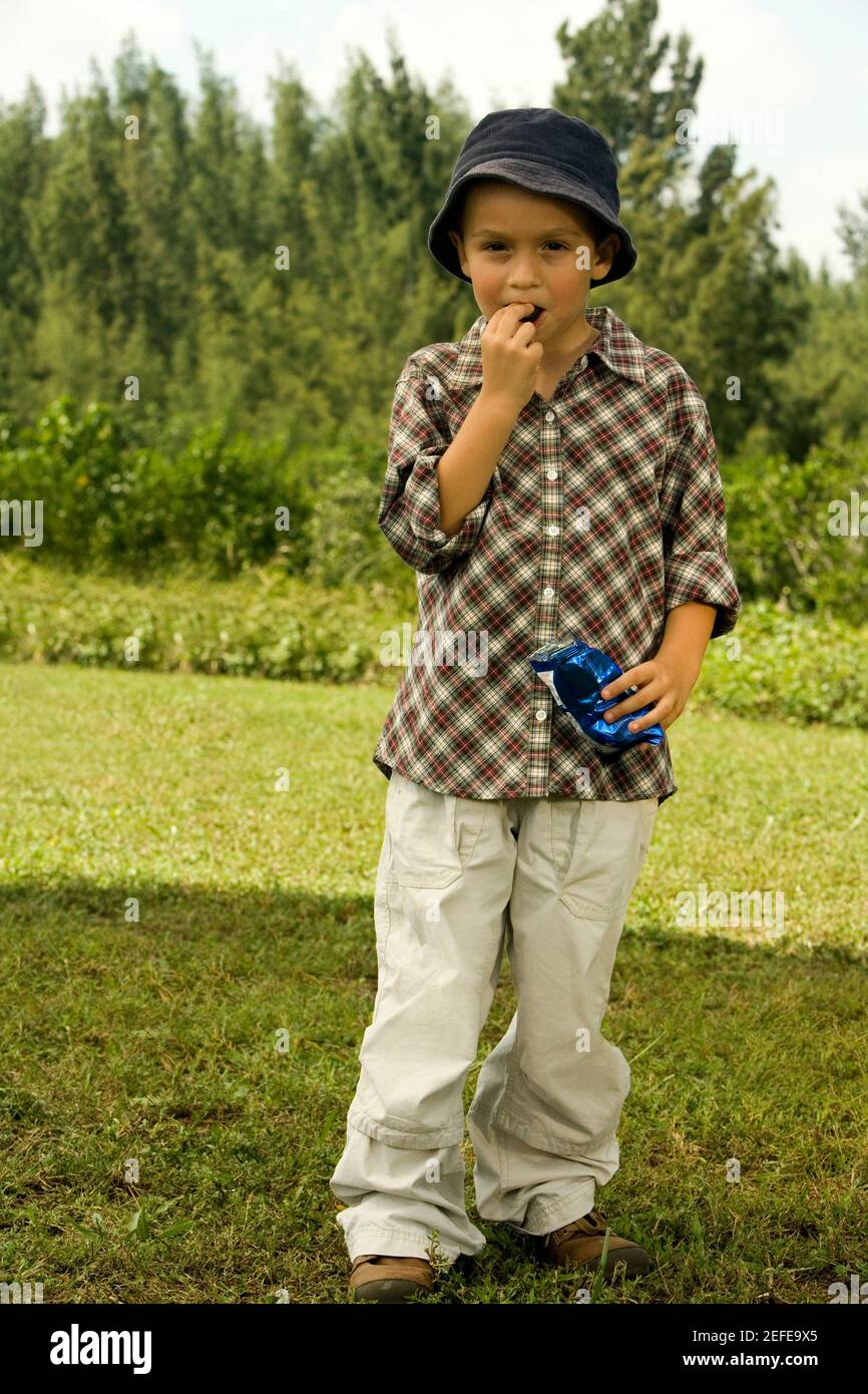 Portrait of a boy eating a chocolate Stock Photo - Alamy
