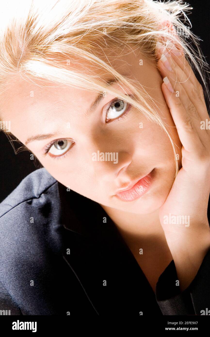 Portrait of a young woman thinking Stock Photo - Alamy